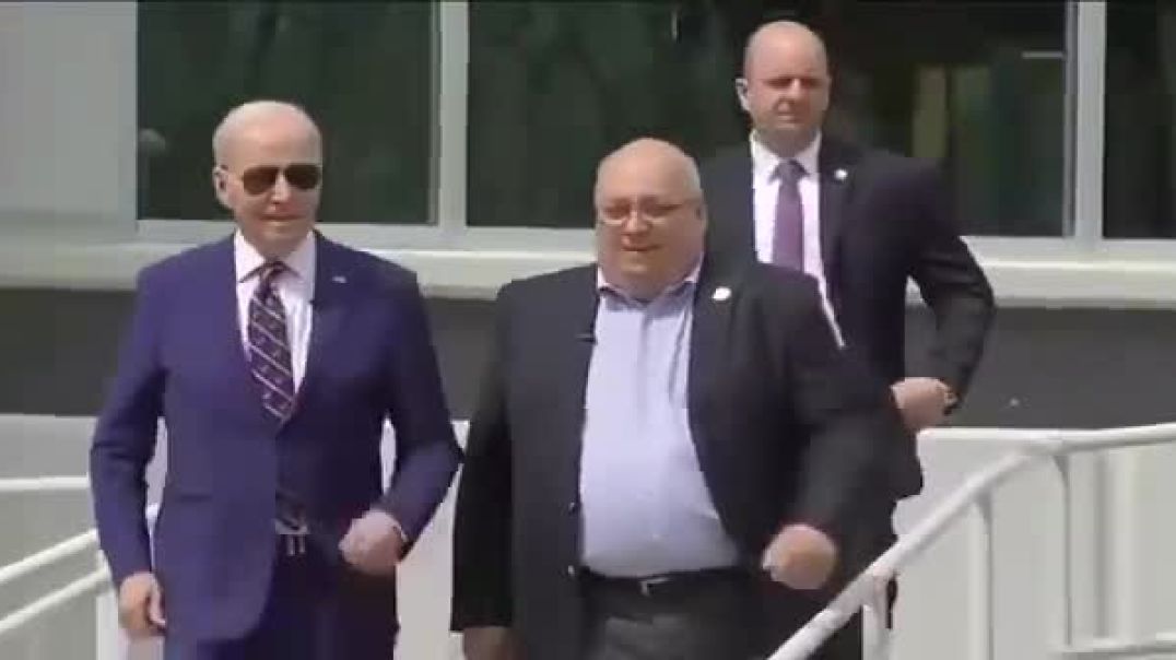 Embarrassing Video Of Biden Being Handled